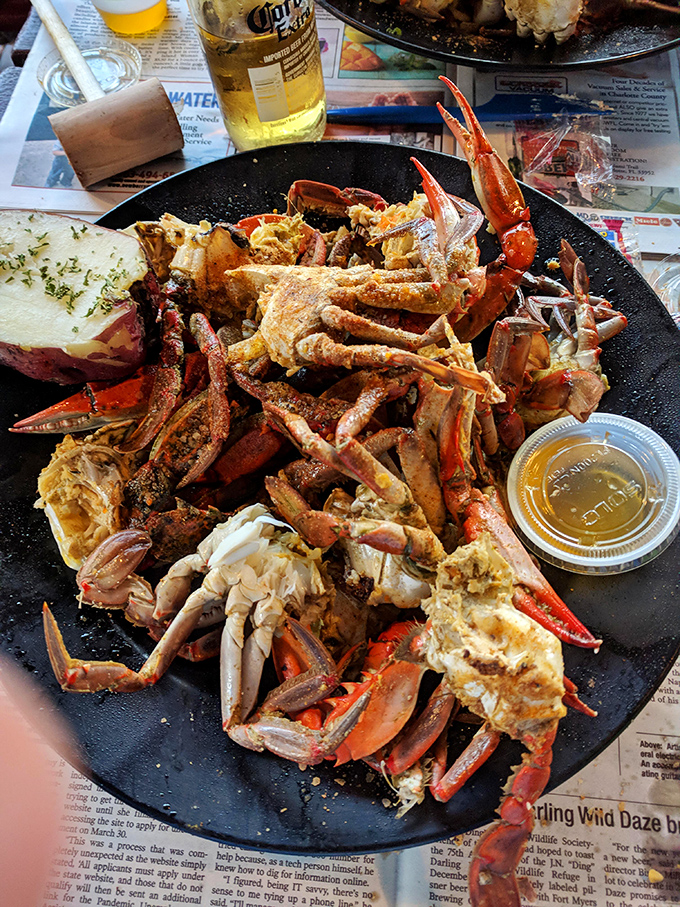 Garlic crab clusters that look like they've been blessed by the Old Bay gods. The potato on the side isn't decoration&mdash;it's there to soak up that precious, finger-licking sauce.