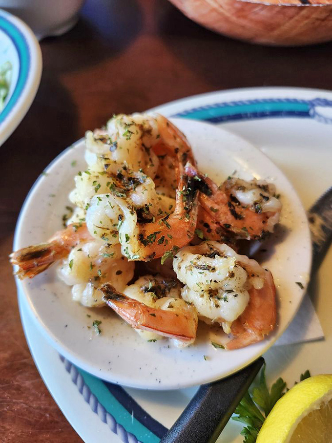 These garlic shrimp aren't just cooked; they're pampered in butter and herbs until they surrender all their sweet, briny goodness.
