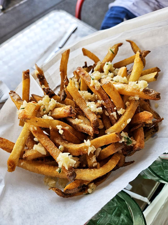 Garlic fries that announce themselves to your taste buds and then to everyone you talk to for the next six hours. Worth it.