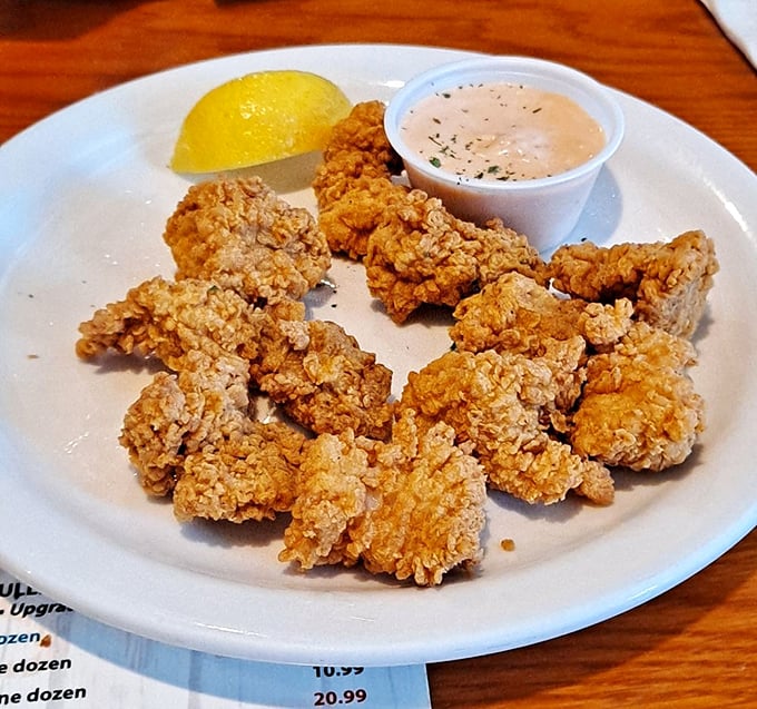 Golden-fried perfection with a side of dipping sauce &ndash; proof that simple preparation often yields the most satisfying results when the ingredients are this fresh.