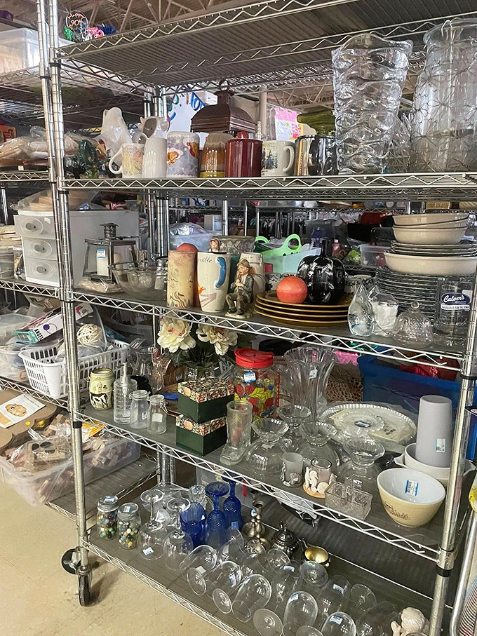 Glassware galore! From vintage vases to everyday tumblers, these shelves hold enough vessels to serve drinks at a Packers tailgate party for the entire stadium.