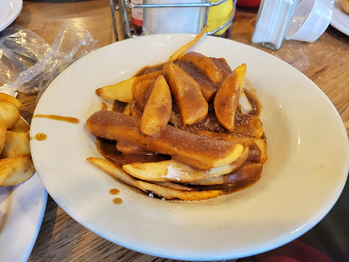 Whoever first decided to pour gravy over French fries deserves a Nobel Prize. This plate is the comfort food equivalent of winning the lottery.