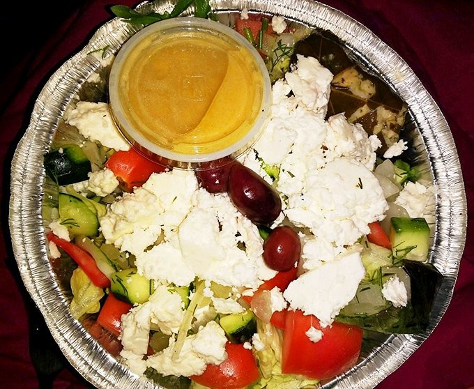 A Greek salad that doesn't skimp on the feta&mdash;chunky, fresh, and vibrant enough to make you momentarily forget you came for the pie.