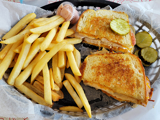Comfort food perfection: a golden-grilled sandwich with fries that would make any potato proud. The pickle chips are the supporting actors who steal the scene.