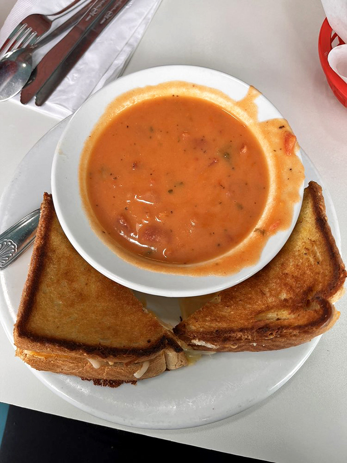 Grilled cheese and tomato soup: childhood comfort reimagined for grown-up taste buds. The ultimate rainy day romance on a plate.