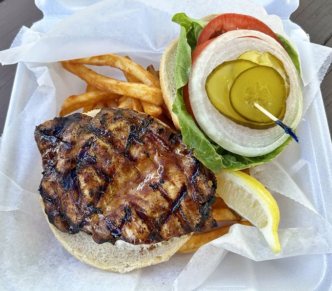 This grilled grouper sandwich doesn't need fancy accessories&mdash;just fresh fish, simple toppings, and a squeeze of sunshine-yellow lemon.