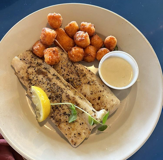 Perfectly blackened fish that doesn't hide behind fancy presentation. Those tater tots aren't just a side&mdash;they're little golden nuggets of nostalgia.