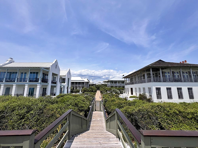 The wooden boardwalk creates a dramatic reveal of the Gulf, with pristine homes standing like sentinels guarding access to those famous sugar-white beaches.