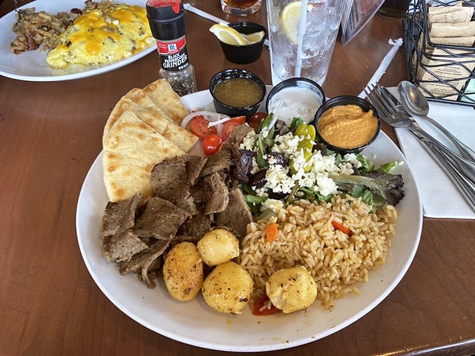The gyro platter that transports you to Greece without the jetlag&mdash;seasoned meat, vibrant salad, and fluffy rice in perfect harmony.