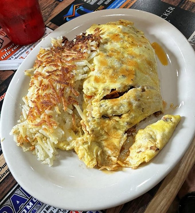 An omelet that's seen the inside of a real kitchen, not a corporate manual. Those hashbrowns have the crispy-to-tender ratio mastered.