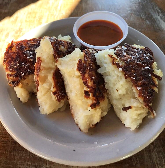 These aren't your diner's hash browns&mdash;they're potato pancakes with ambition, golden-crisp exteriors hiding fluffy, savory centers.