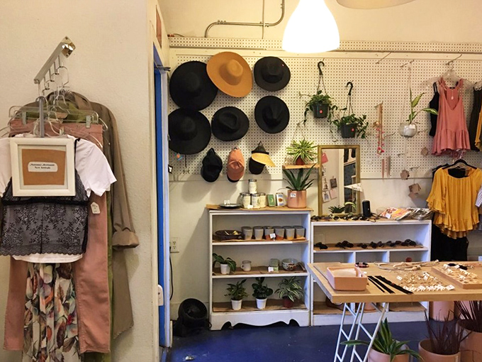 A wall of hats that would make any Old Hollywood costume department jealous. Your Instagram profile pic is waiting somewhere on this display.