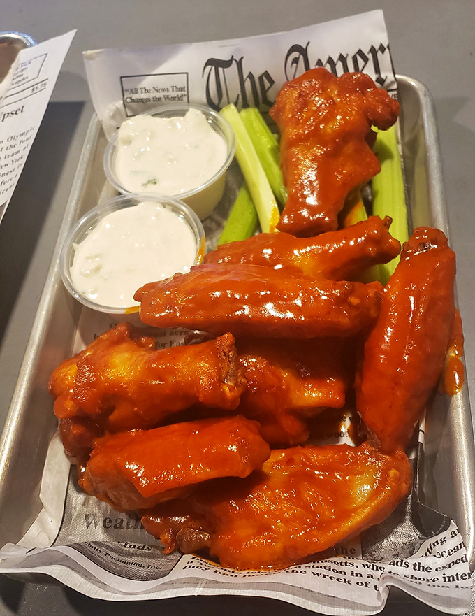 Wings that wear their sauce like a proud battle uniform. These aren't just spicy&mdash;they're the kind that make you both sweat and immediately reach for another.