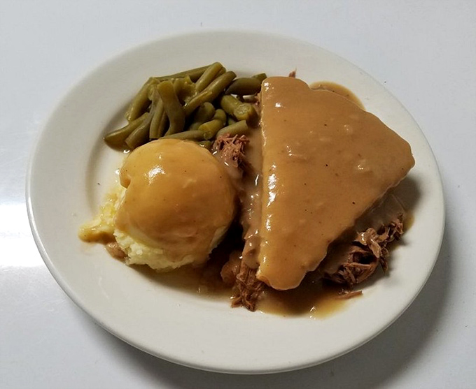 Hot roast beef that doesn't need Instagram filters to look good. Tender meat, gravy that could solve world problems, and sides that know their supporting role.