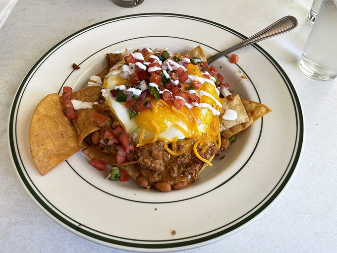 When breakfast can't decide if it wants to be comfort food or fiesta food, you get this glorious plate of huevos that says "&iquest;Por qu&eacute; no los dos?"