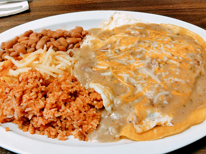 Huevos Rancheros: where eggs meet gravy in a relationship so perfect, it deserves its own reality show. The Spanish rice plays supporting actor brilliantly.