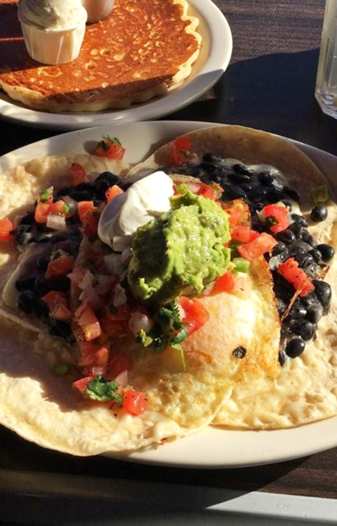 This plate doesn't just serve breakfast; it tells a delicious cross-cultural story where eggs, beans, and avocado live together in perfect harmony.