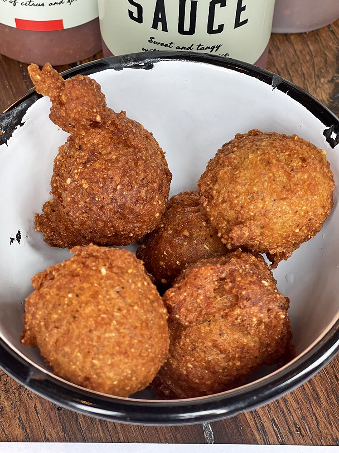 These hush puppies aren't just fried cornmeal&mdash;they're golden orbs of happiness with the perfect crisp-to-tender ratio that would make your grandmother jealous. 