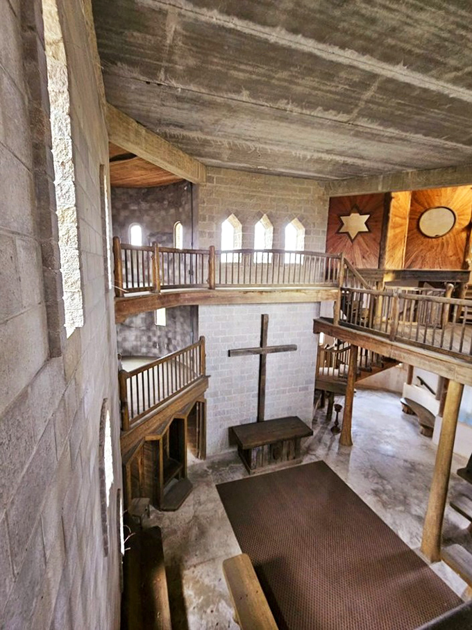 The interior reveals the castle's spiritual purpose with wooden balconies, a cross, and a sanctuary-like atmosphere that whispers rather than shouts.