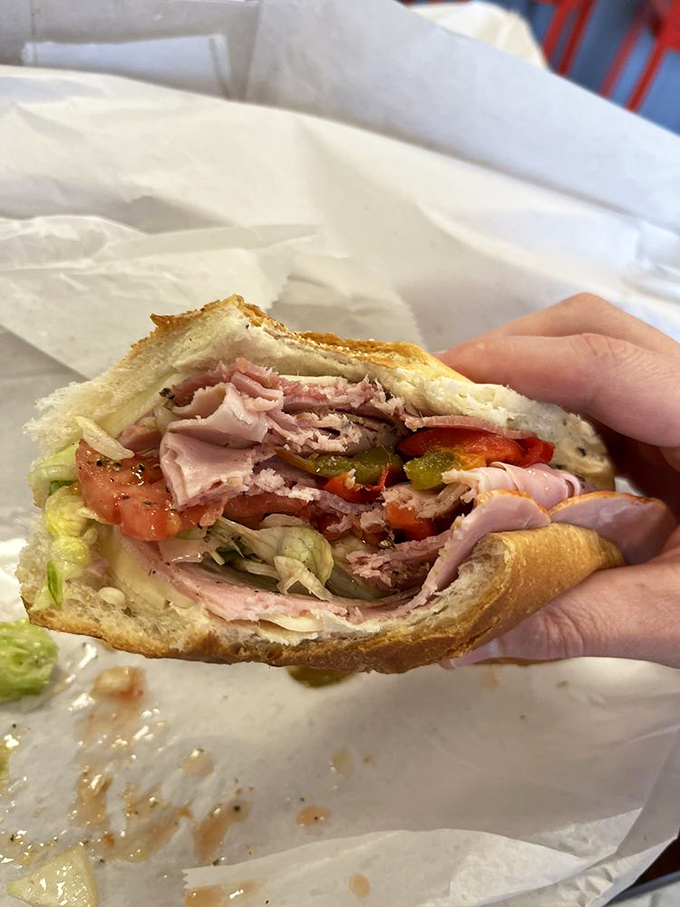 Layer upon glorious layer&mdash;meat, veggies, and bread in perfect harmony. This isn't just a sandwich; it's edible engineering at its finest.