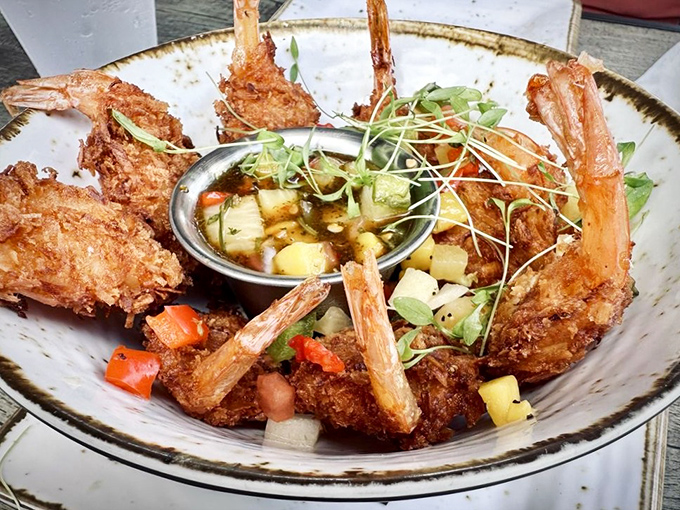 Coconut shrimp standing tall like edible sculptures, each bite a tropical vacation for your taste buds.