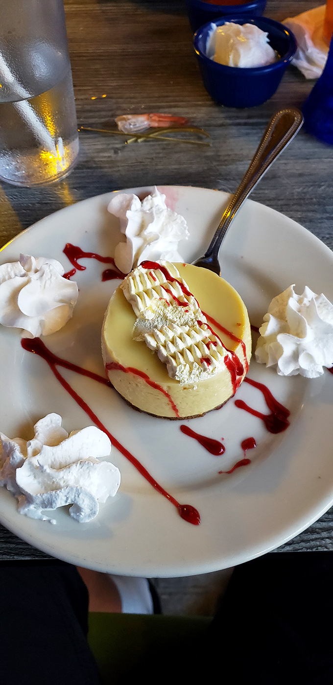 This key lime pie isn't just dessert; it's Florida sunshine on a plate – tangy, sweet, and adorned with whipped cream dollops like little clouds of happiness.