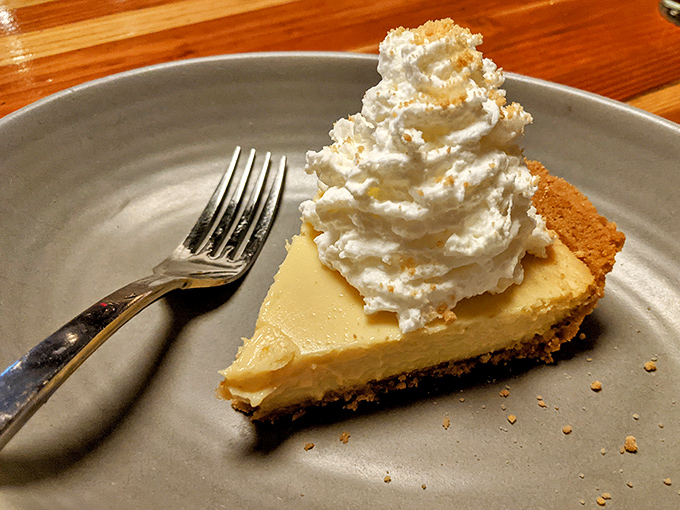 Key lime pie that strikes the perfect balance between tart and sweet, topped with a cloud of whipped cream.
