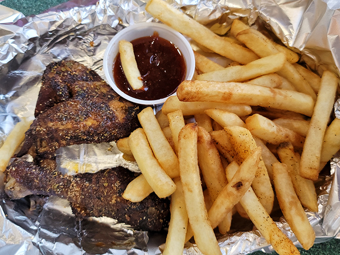 Perfectly seasoned chicken wings with golden fries—proof that even the kids' menu takes no prisoners at Granny's Smokehouse.