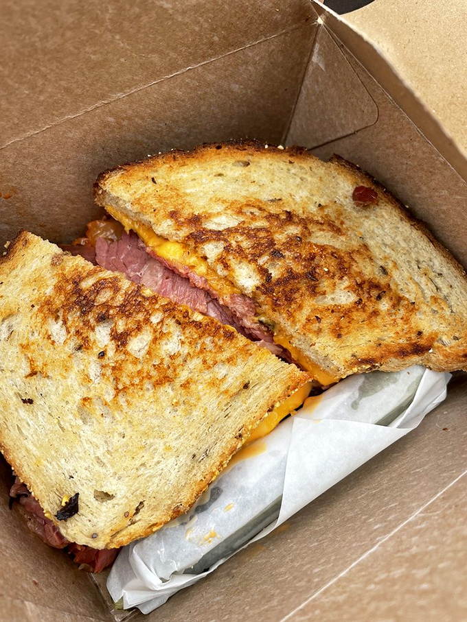 The grilled sandwich in its natural habitat &ndash; a cardboard container that barely contains the melty, meaty magnificence within.