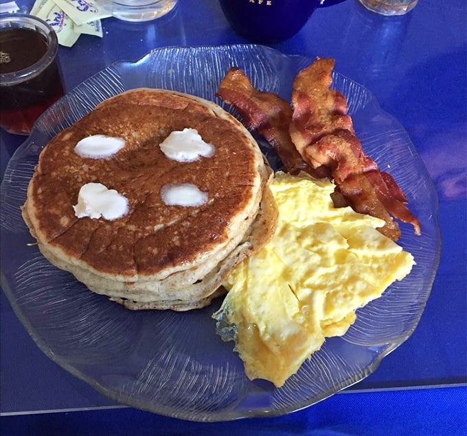 The breakfast trinity&mdash;golden pancake, scrambled eggs, and bacon that's achieved that perfect crisp-yet-chewy texture that breakfast dreams are made of.