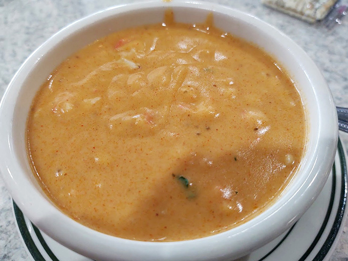 Lobster bisque that glows with amber promise—each spoonful delivers a velvety symphony of seafood flavor that would make coastal chefs envious.