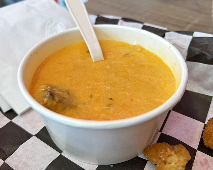 This lobster bisque isn't just soup—it's a creamy, coral-colored vacation in a bowl that whispers, "Cancel your afternoon plans."