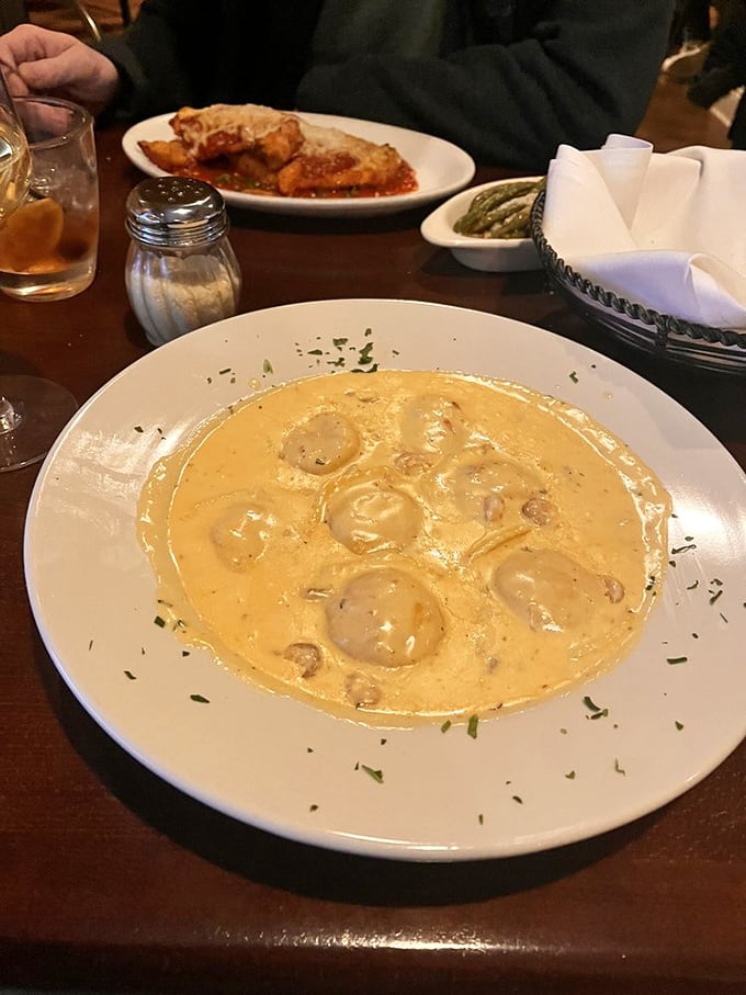 Cream sauce so luxurious it should come with its own red carpet, cradling tender lobster ravioli that tastes like the ocean's finest gift.