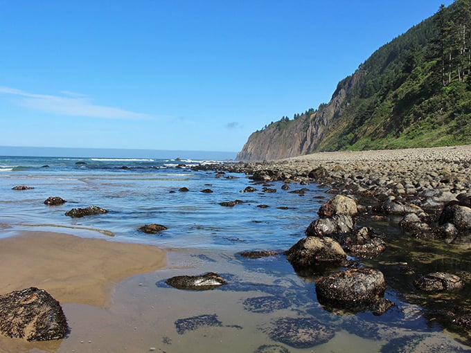 Low tide reveals the beach's hidden treasures&mdash;tide pools and smooth stones that tell the ocean's ancient stories.