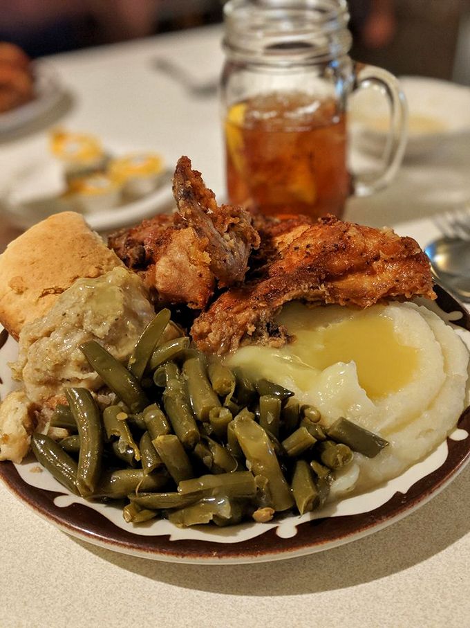 A perfect harmony of crispy chicken, garden-fresh green beans, and potatoes swimming in gravy&mdash;with a biscuit standing by for gravy duty.