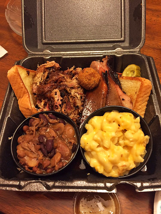 A BBQ plate that tells a story&mdash;smoky meat, beans with attitude, and mac and cheese so yellow it could direct traffic.