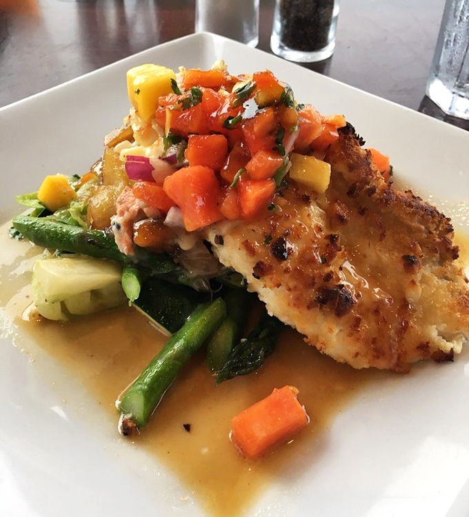 Macadamia-crusted fish perched atop vibrant vegetables&mdash;proof that sometimes the prettiest dishes are also the most delicious.