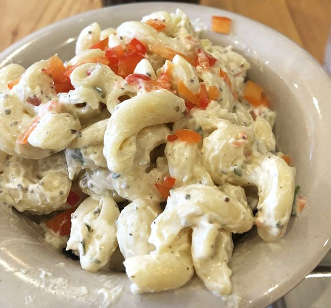 Not your cafeteria lady's macaroni salad. Each spiral cradles creamy dressing and vegetables in a pasta hug worth remembering.