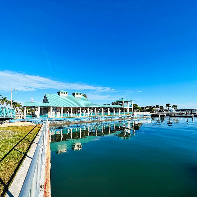 The waterfront pavilion reflects in crystal waters, a reminder that retirement should always include views this spectacular.