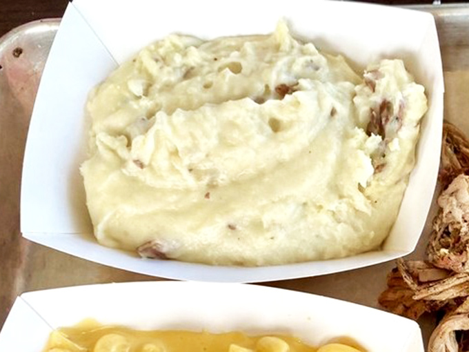 Mashed potatoes so creamy they should require a warning label. Comfort food that makes you want to hug whoever made it.