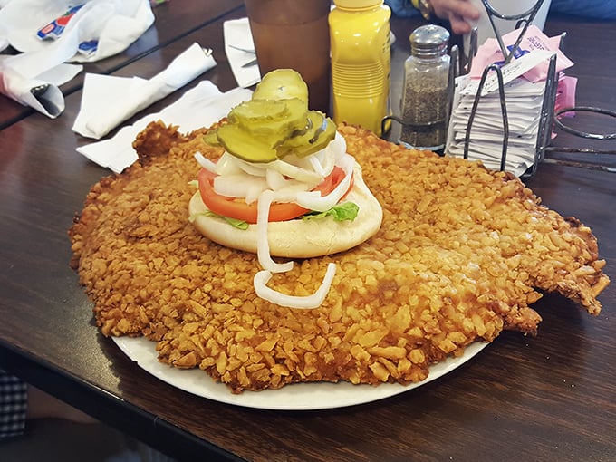 Indiana's unofficial state sandwich in its natural habitat &ndash; a tenderloin so massive it requires strategic planning just to take the first bite.