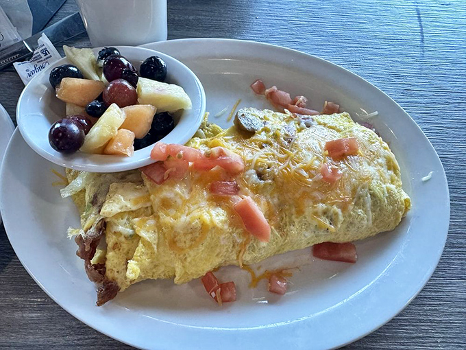 An omelet that's not messing around. With fresh fruit playing wingman, this protein-packed breakfast means serious morning business.