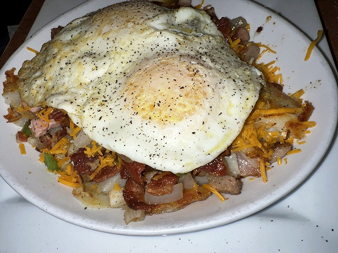 A skillet that could fuel a marathon&mdash;eggs perched atop a mountain of potato, meat, and cheese. Breakfast architecture at its finest.