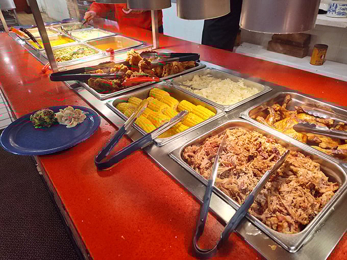 The buffet isn't messing around – steam rises from trays of pulled pork, fried chicken, and hearty sides that promise satisfaction by the spoonful.