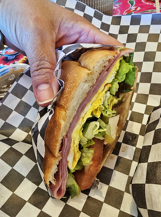 Not just a sandwich&mdash;a torta masterpiece where fresh bread, ham, and crisp vegetables come together in perfect structural integrity.