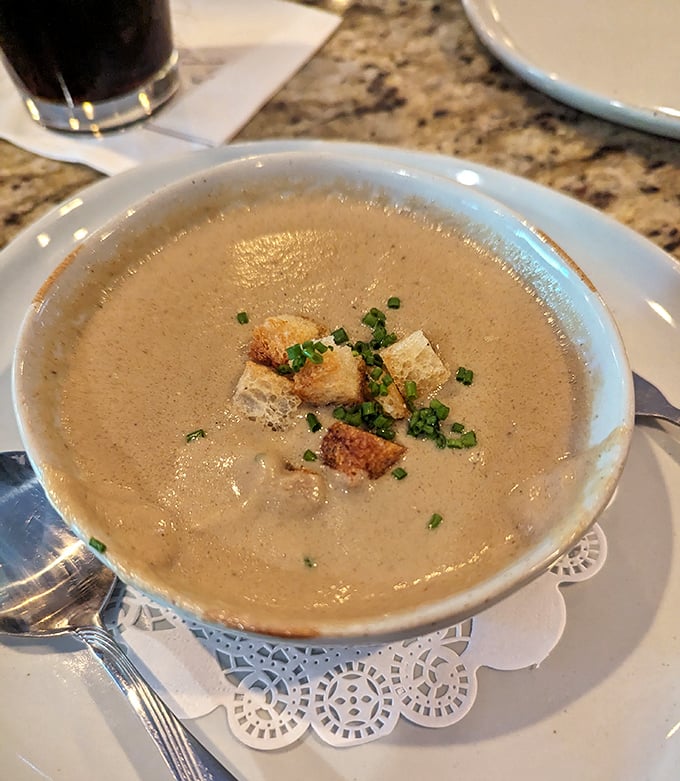 A mushroom soup so velvety it could moonlight as a spa treatment for your taste buds, with croutons playing the role of delicious little life rafts.