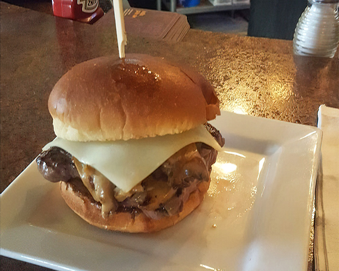 The mushroom and Swiss burger: proof that fungi and dairy can elevate a simple patty from "dinner" to "religious experience."