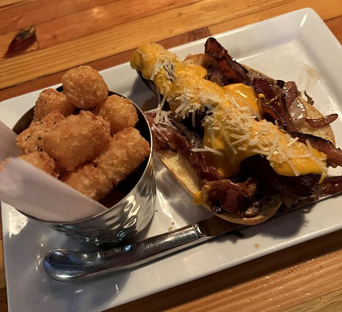 Hot dogs get the royal treatment too. This loaded beauty sits beside tots so perfectly golden they deserve their own Instagram account.