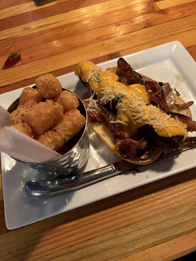 When a hot dog gets the Engine No. 9 treatment, it emerges transformed—draped in cheese and bacon with tots standing guard nearby.