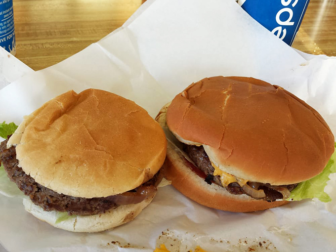 Two classic burgers, side by side like an old married couple. No arguments here&mdash;just perfectly grilled patties and fresh toppings.